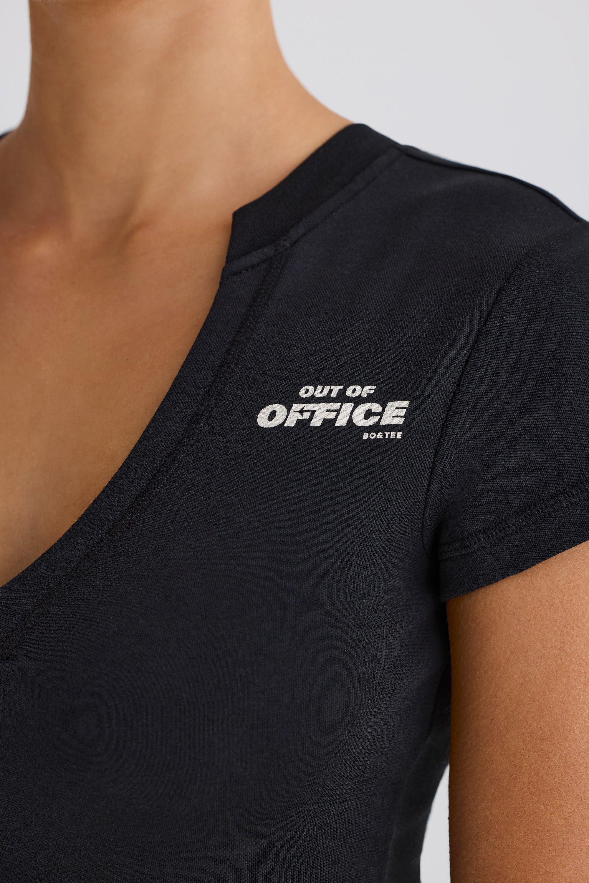 Jet Set Graphic-Print Cropped T-Shirt in Black | Oh Polly