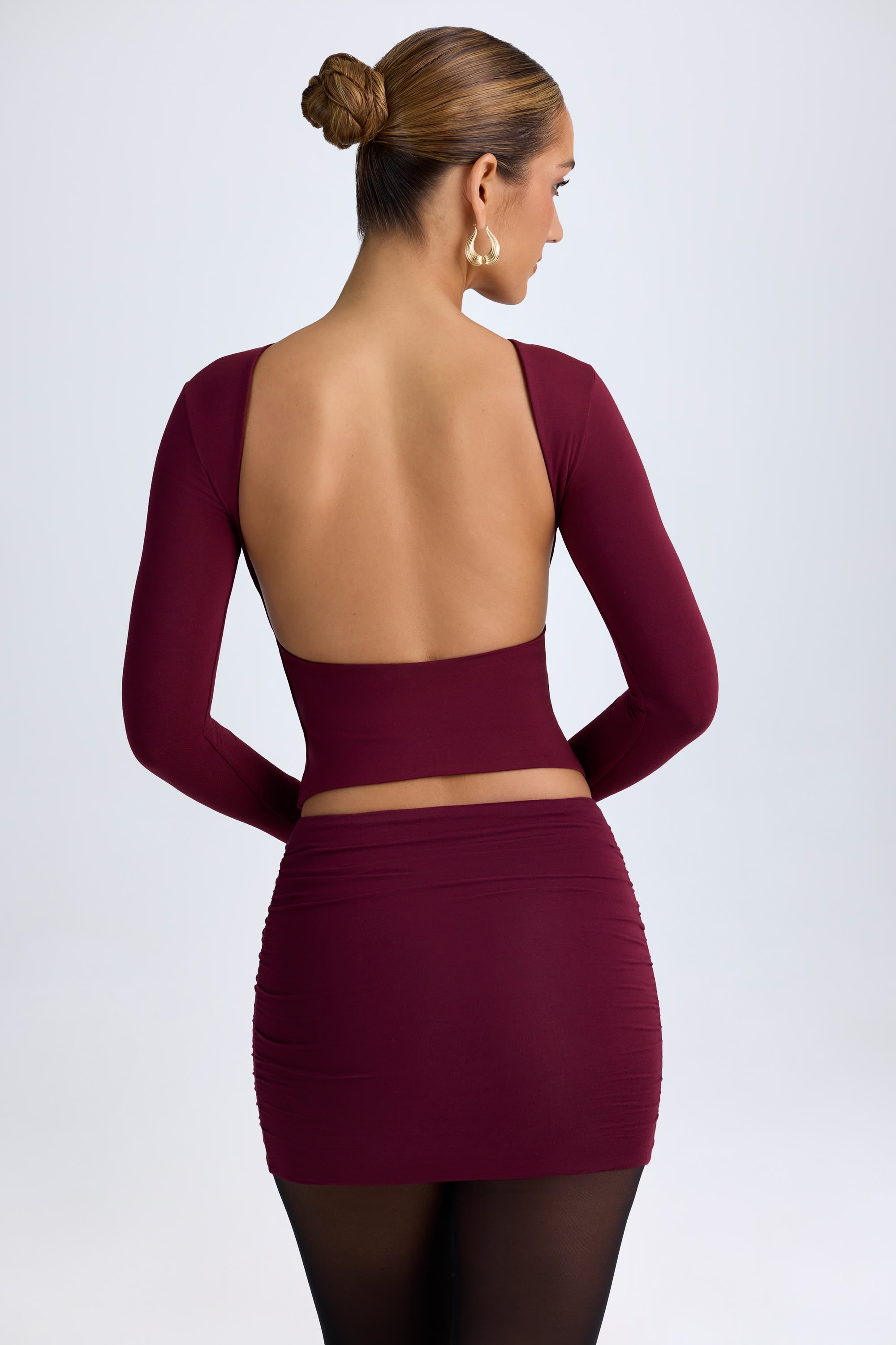 Cali Modal Ruched Mid-Rise Mini Skirt in Wine Red | Oh Polly